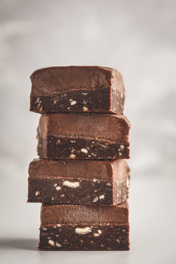 Stack of Chocolate Fudge Bars on White Background. Raw Vegan Dessrt ...