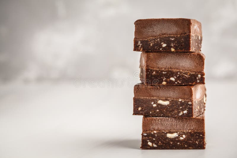 Stack of Chocolate Fudge Bars on White Background. Raw Vegan Dessrt ...