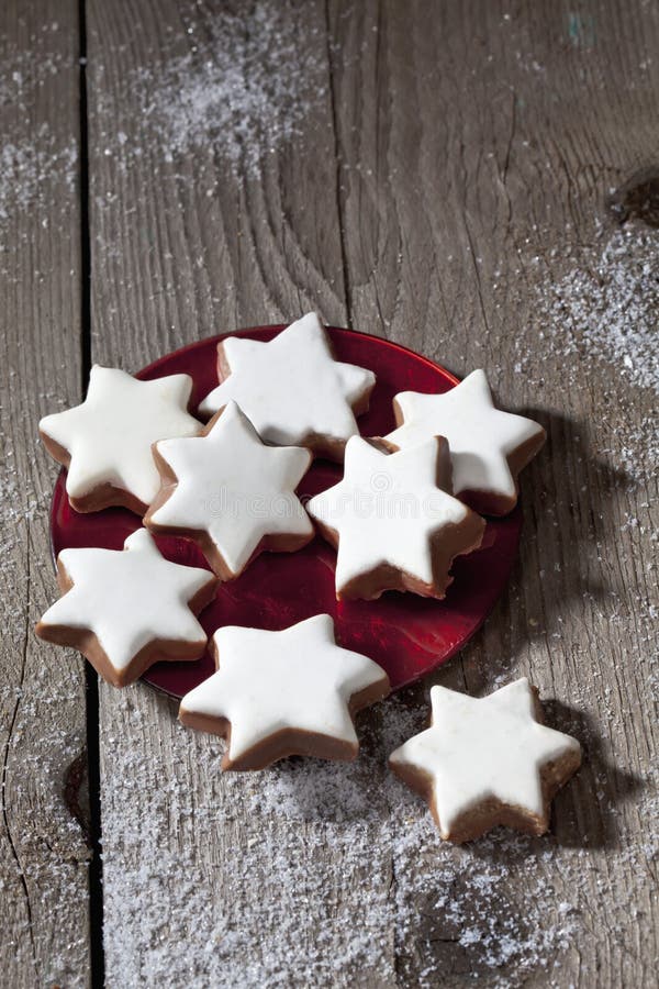 Stack of Cinnamon Stars on Plate on Wooden Floor Stock Image - Image of ...