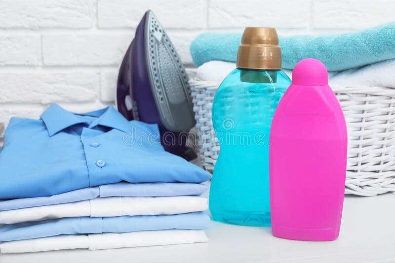 Stack of Clean Clothes, Iron, Detergents Stock Image - Image of indoors ...