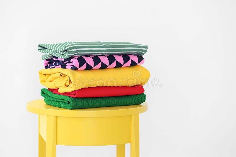 Stack of Clean Clothes on Stool Stock Image - Image of stool, stack ...