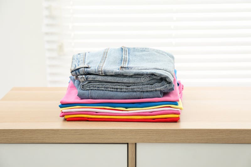 Stack of Clean Clothes on Wooden Dresser Indoors Stock Image - Image of ...