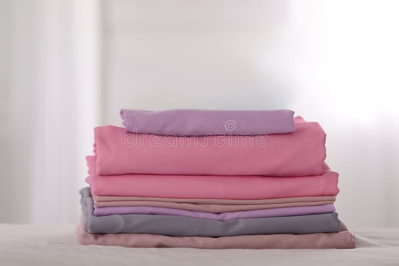 Stack of Clean Color Folded Linens on Bed Stock Image - Image of home ...