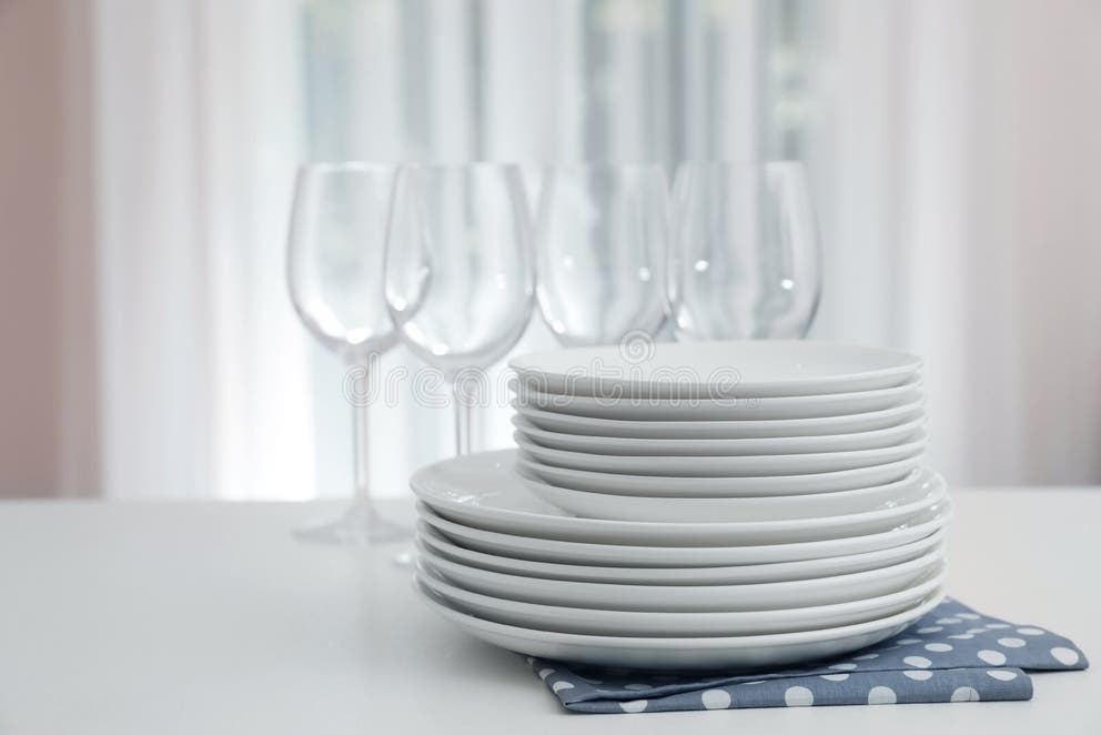 Stack of Clean Dishes and Glasses on Table Stock Image - Image of ...