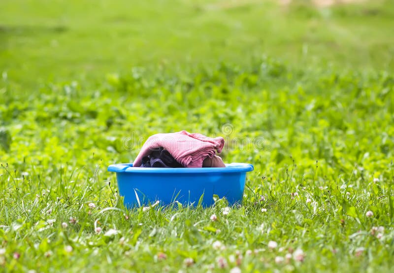 Stack of Clean Laundry in Plastic Cup Outdoors Stock Image - Image of ...