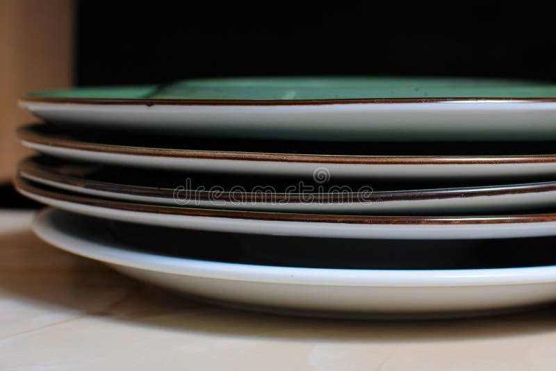 A Stack of Clean Plates is on the Table Stock Photo - Image of ...