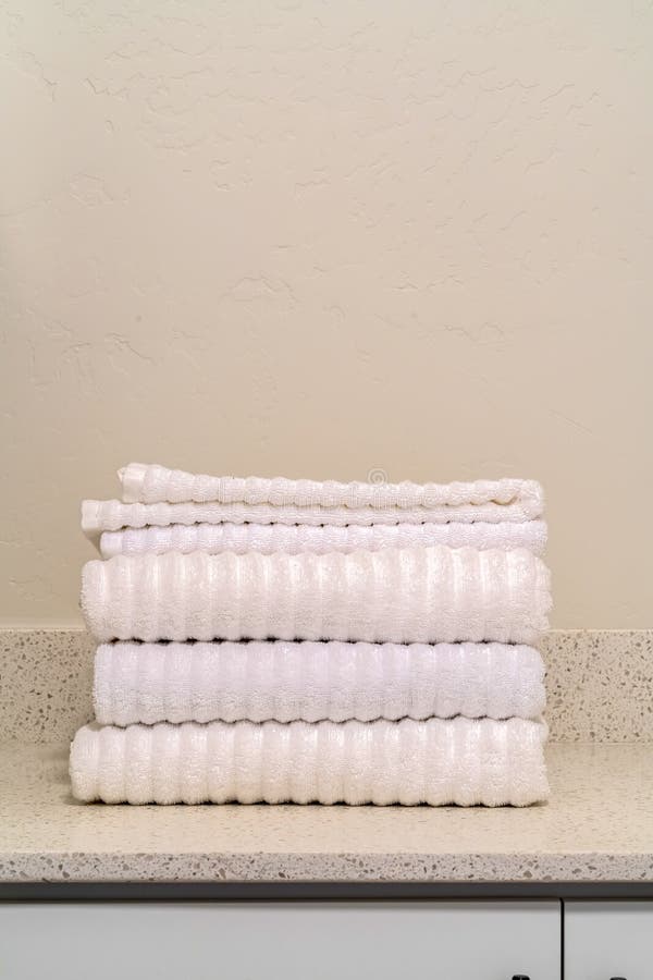 Stack of Clean White Ribbed Towels in a Bathroom Stock Image - Image of ...