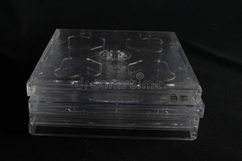 Stack of Clear Retro CD Cases with No Compact Discs Against a Black ...