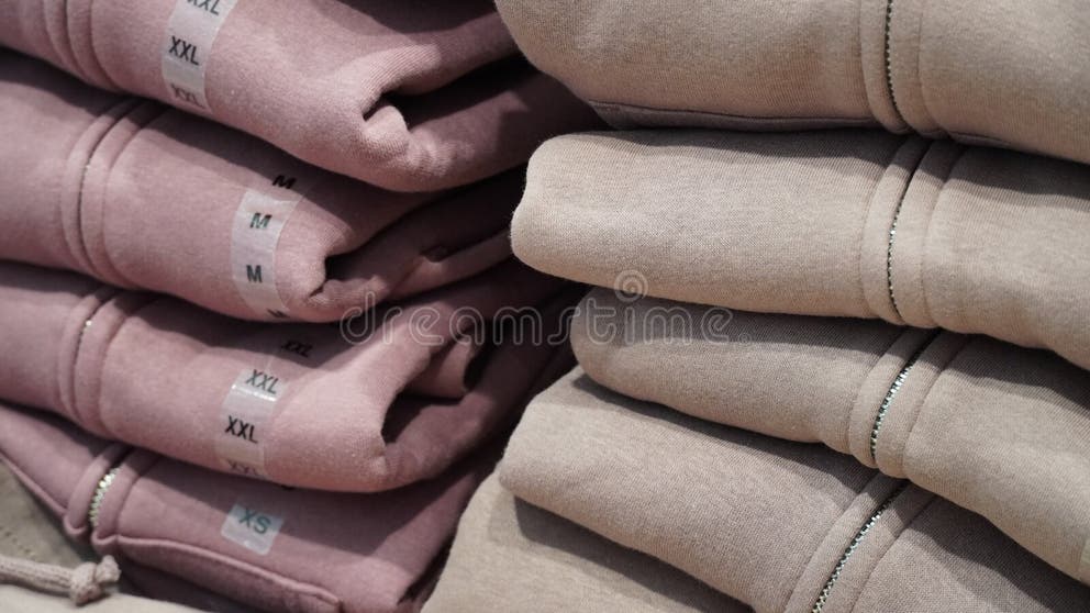 Stack of Cloth Different Colors and Sizes on the Shelves in a Clothes ...