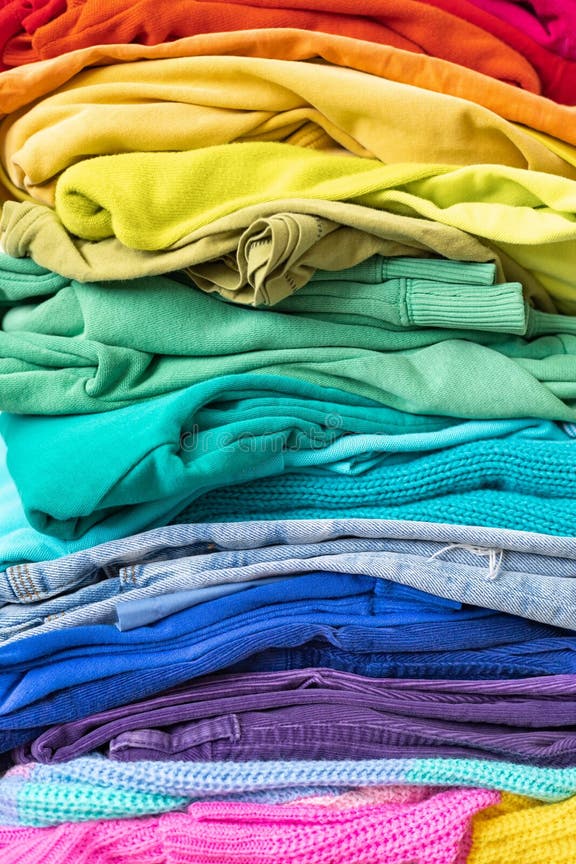 A Stack of Clothes in Different Colors. the Concept of Conscious ...