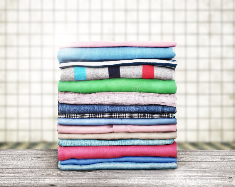 Stack of Clothes in a Laundry Room Stock Photo - Image of clothes ...