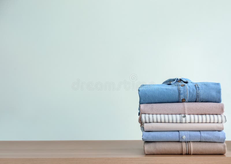 Close Up of Ironed and Folded Shirts on Table Stock Photo - Image of ...