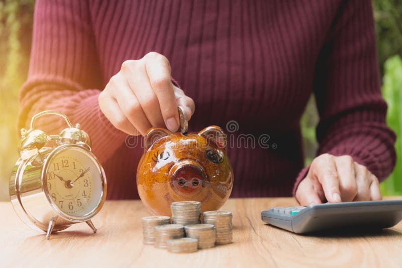 Hand Drop a Coin with Money Coin Stack Growing for Business. Financial ...