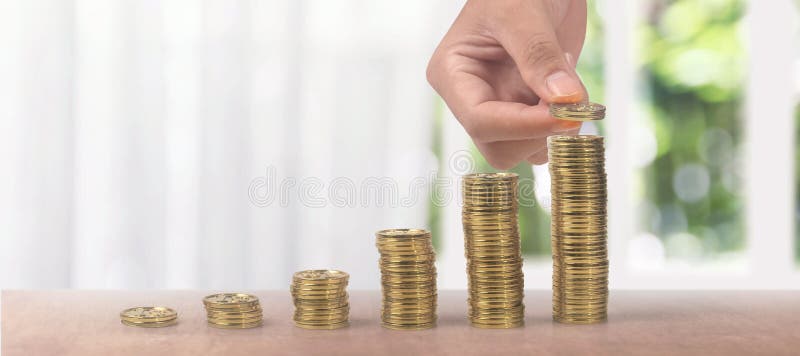 Stack Coin in Hand with Trading Graph, Financial Investment Concept ...