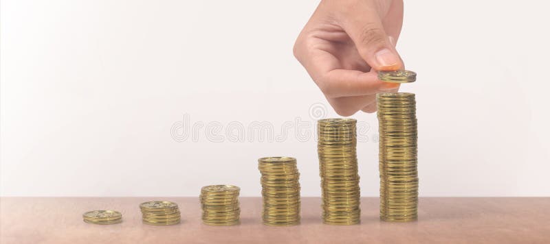 Stack Coin in Hand with Trading Graph Financial Investment Concept ...
