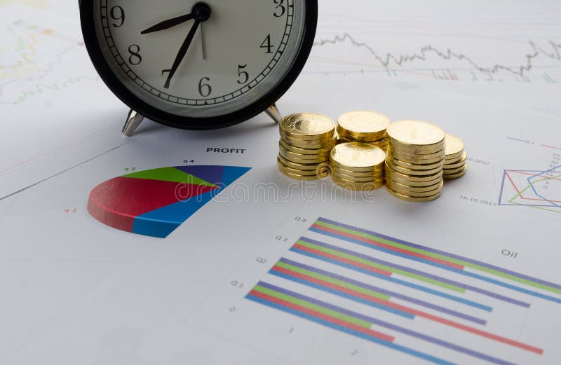Stack of Coins Alarm Clock and Financial Charts Stock Image - Image of ...