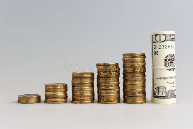A Stack Of Coins And Bundle Of Dollars Stock Image - Image of dollars ... A Stack Of Coins And Bundle Of Dollars Stock Image - Image of dollars ...