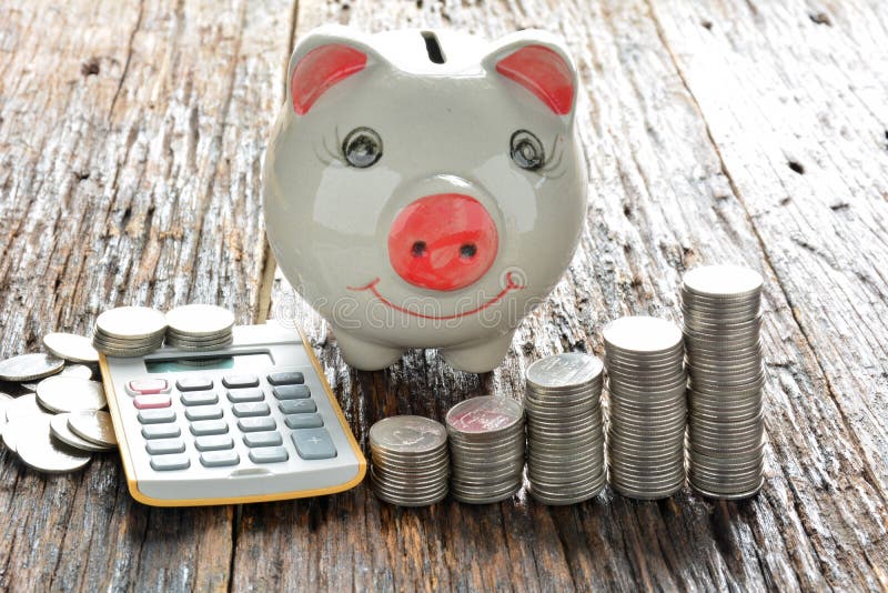 Stack Coins, Calculator and Piggy Bank on Wood Table Stock Image - Image of savings, concept ...