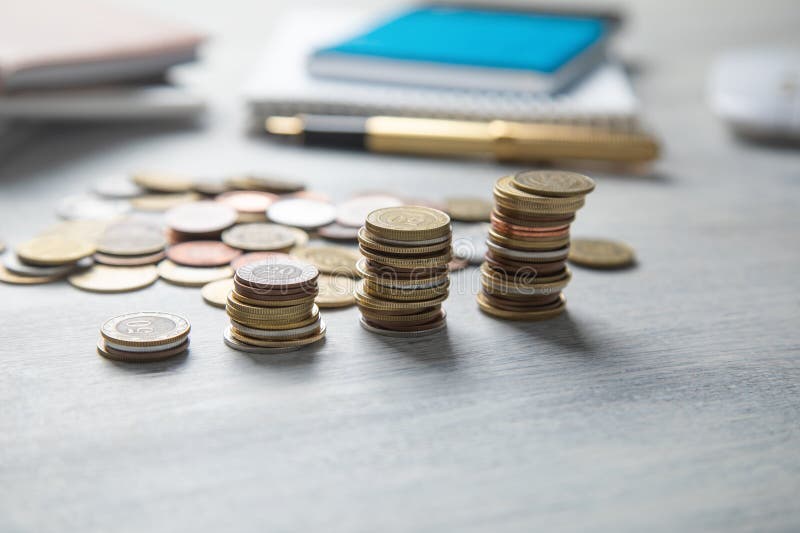 Stack of Coins on the Desk with a Business Objects Stock Image - Image ...