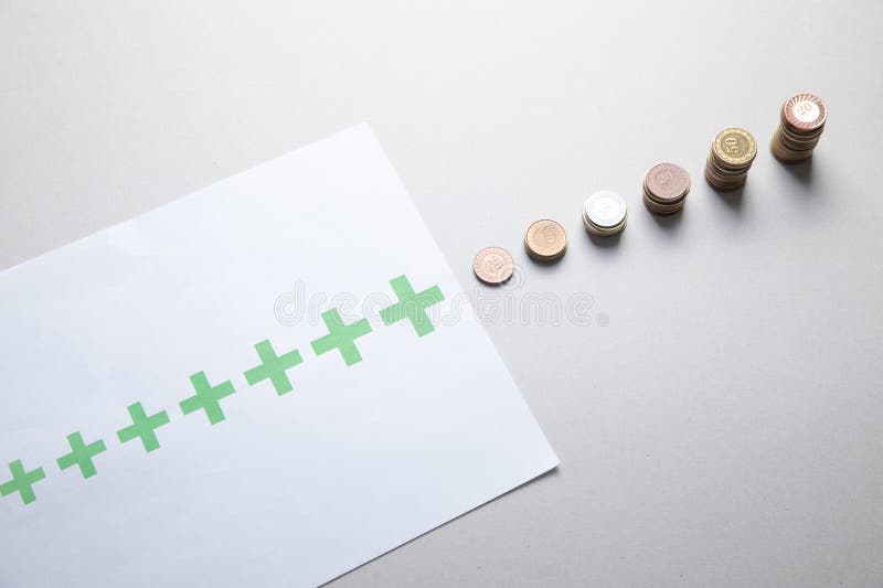 Stack of Coins with a Growing Plus Signs Stock Image - Image of ...