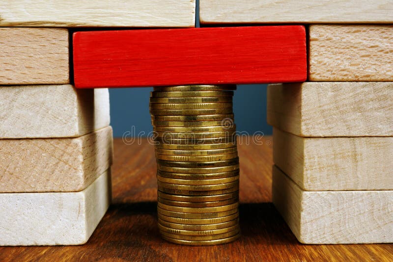Stack of Coins Holds Blocks. Financial Balance and Stability Stock ...