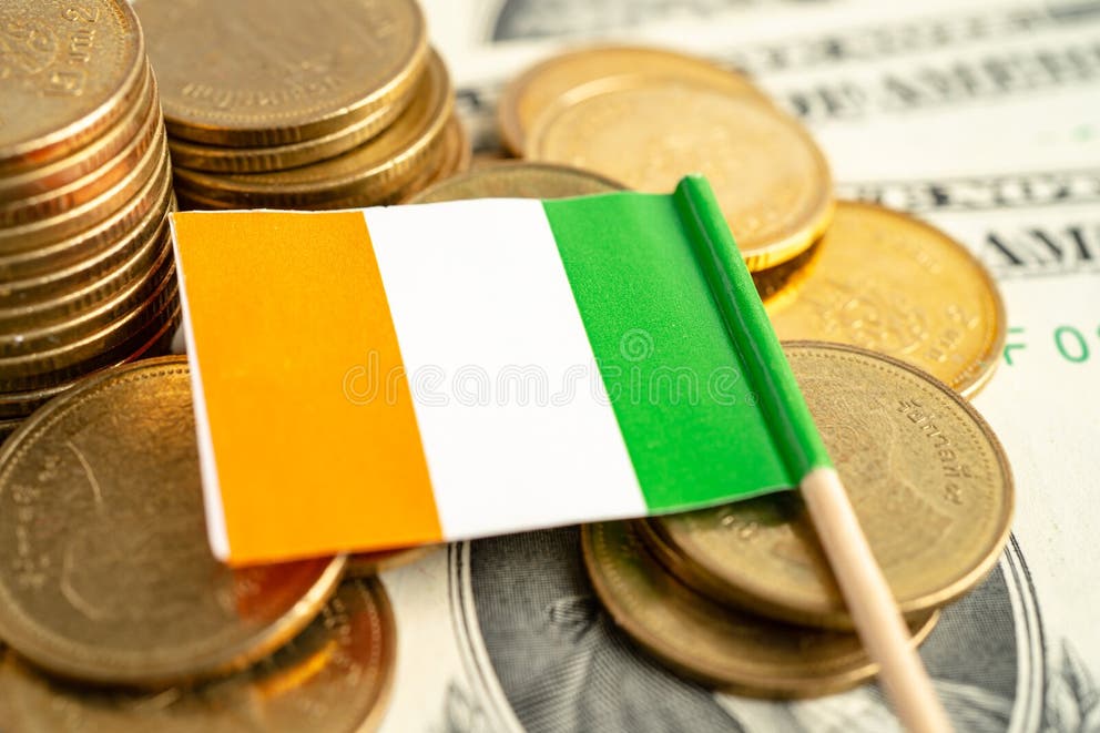 Stack of Coins with Ireland Flag and US Dollar Banknotes Stock Photo ...