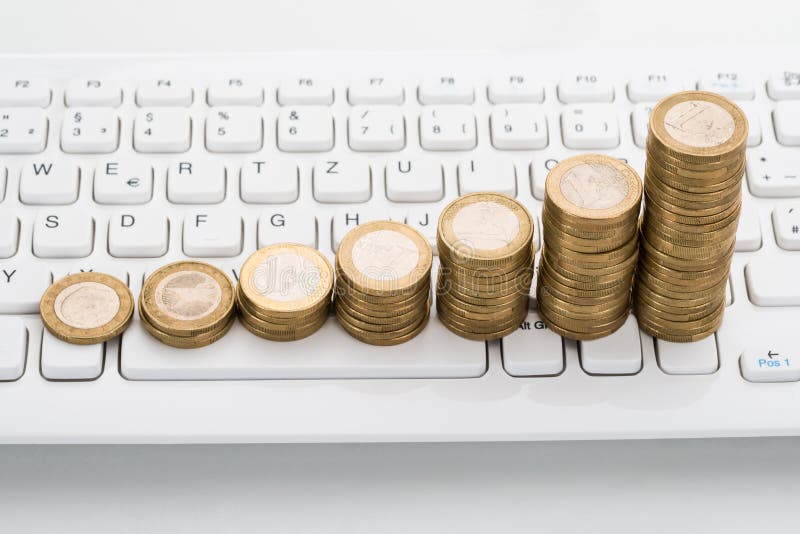Stack of coins on keyboard stock photo. Image of money - 53438030
