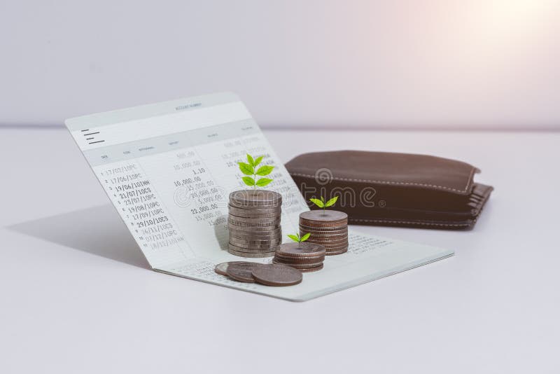 Stack of Coins and Account Book Bank on the Table Stock Image - Image ...