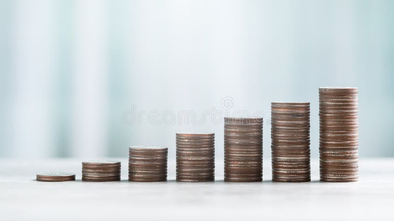 Stack of Coins are Neatly Arranged on a Table Against a Bright White ...