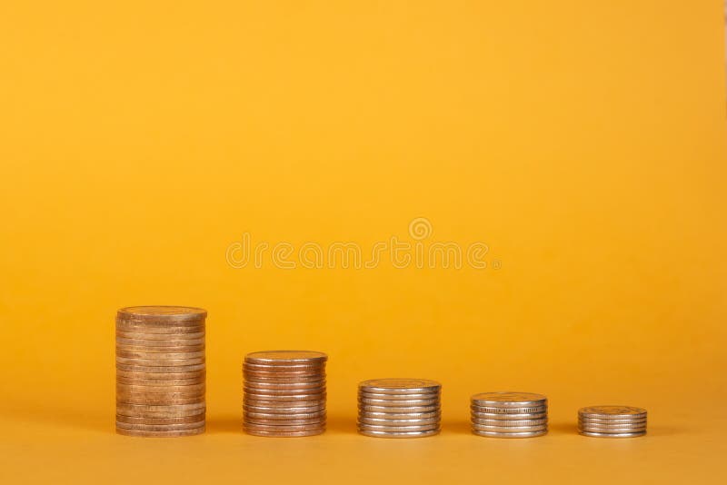 Stack of Coins on a Orange or Yellow Background Stock Photo - Image of ...