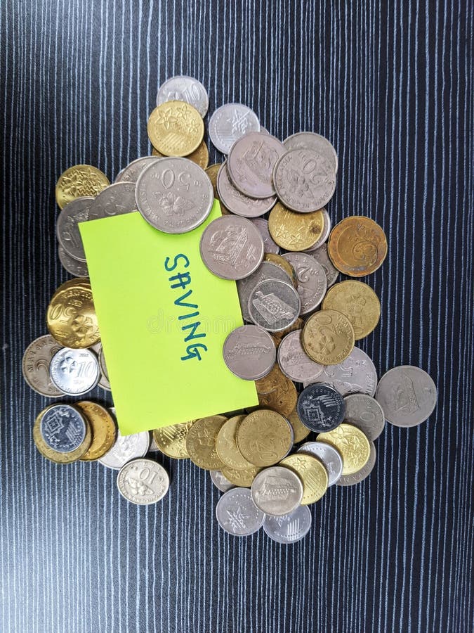 A Stack of Coins with a Saving Label in the Background Stock Photo ...