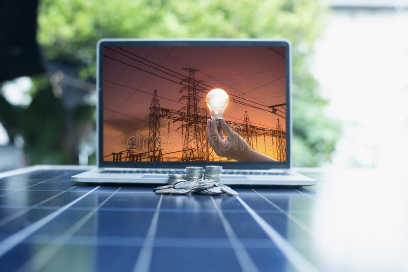Stack of Coins on Solar Panel the Idea of Installing Solar Cells Gives ...