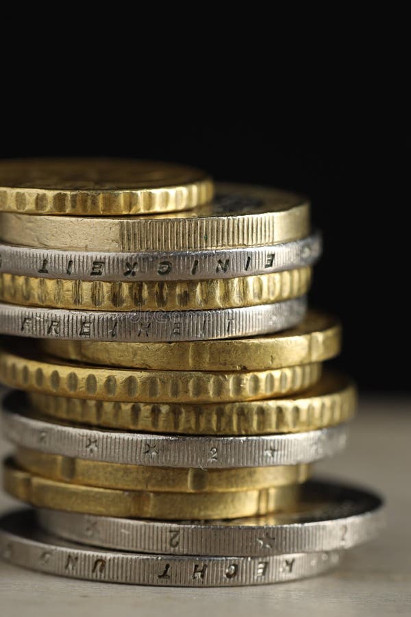 Stack of Coins on Table Against Black Background, Closeup. Salary ...