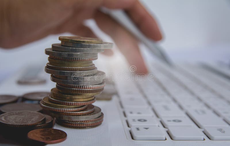 Stack Coins on White Laptop and Finger Press Button on Keyboard. Stock ...