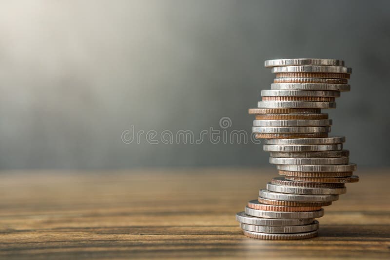 Stack of Coins on Wood Desks and Loft Wall Backgrounds with Sunlight ...