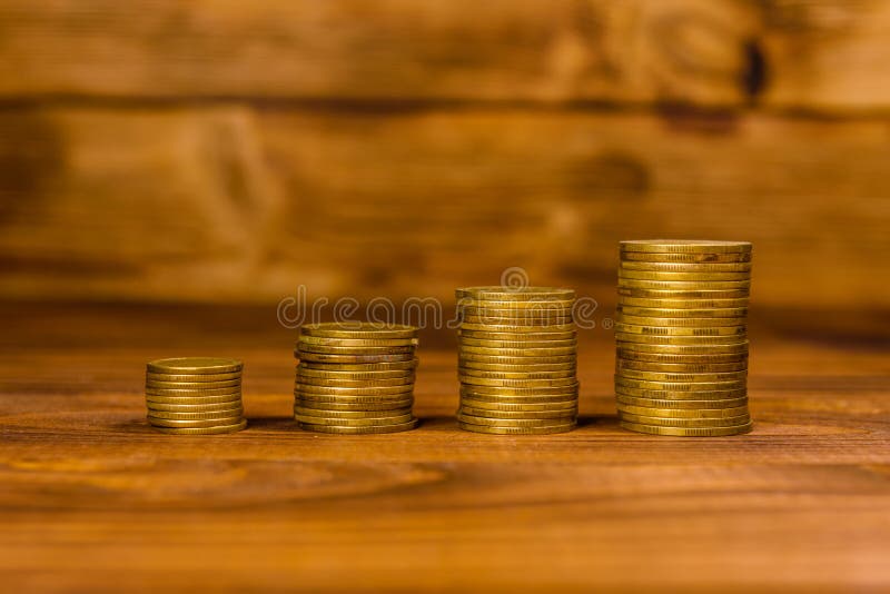 Stack of the Coins on Wooden Table Stock Photo - Image of closeup ...