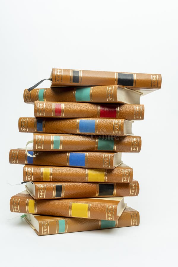 Stack of Color Coded Brown Books on a White Background Stock Photo ...
