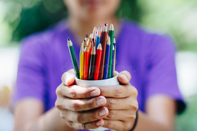 Stack of Colored Pencils in Hands Stock Image - Image of child, finger ...