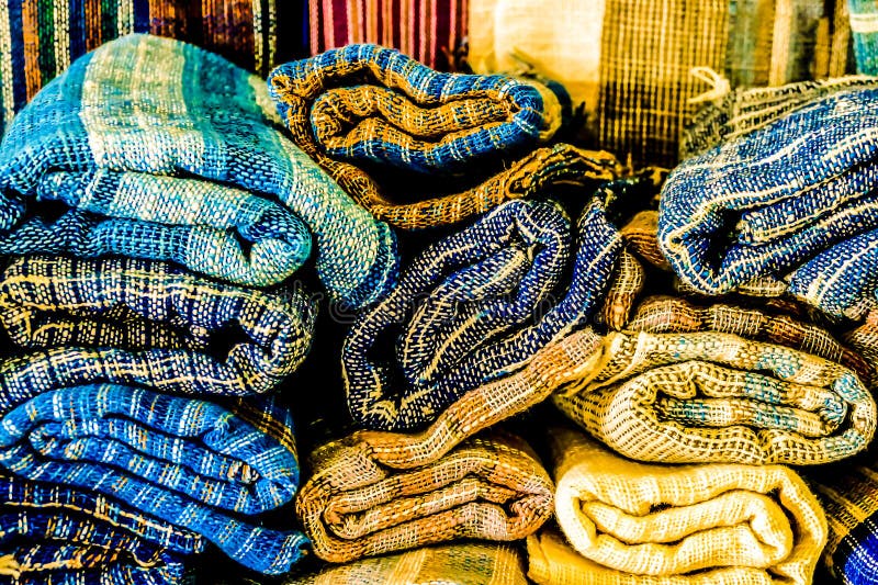 A Stack of Colorful Blankets with a Blue One on Top Stock Image - Image ...