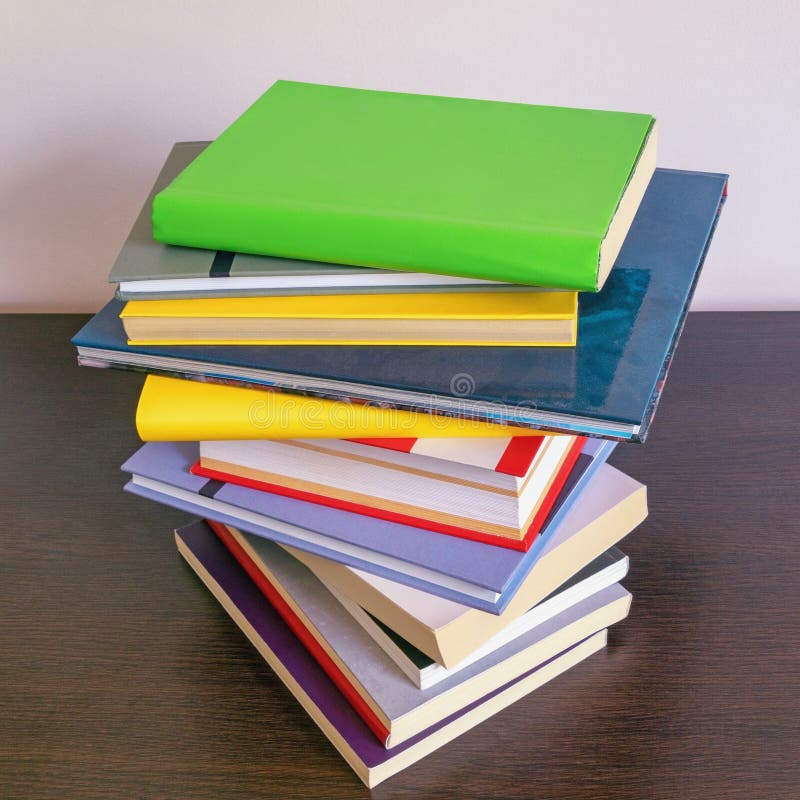 Stack of Colorful Books on Dark Table. Copy Space Stock Photo - Image ...