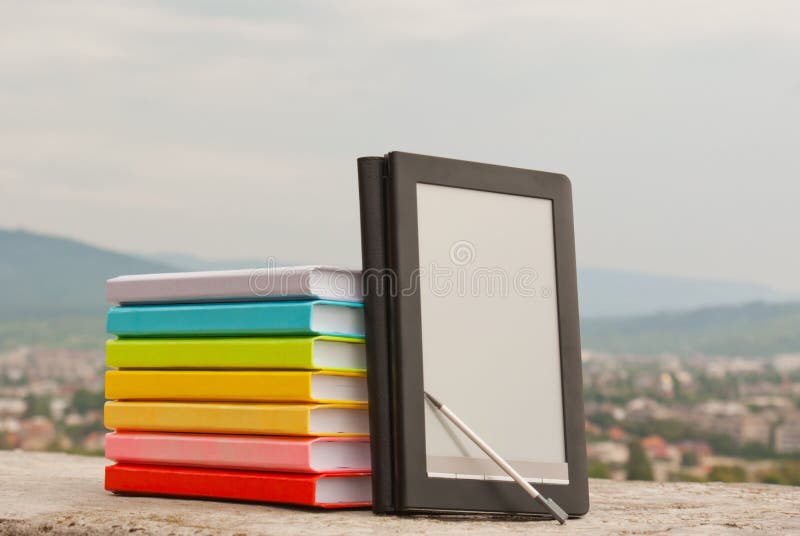 Stack of Colorful Books with E-book Reade Stock Image - Image of ...