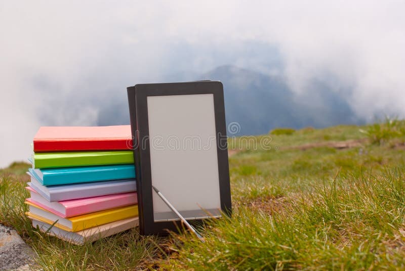 Stack of Colorful Books and Electronic Book Reader Stock Image - Image ...