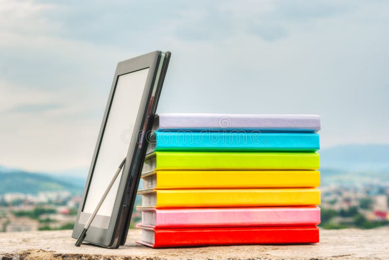 Stack Of Colorful Books With Electronic Book Reader Stock Photo - Image ...