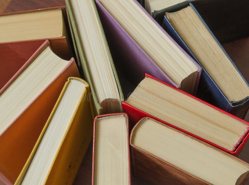 A Stack of Colorful Books in a Library Stock Image - Image of colorful ...