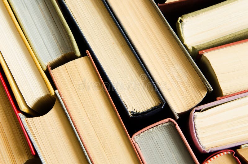 A Stack of Colorful Books in a Library Stock Image - Image of group ...