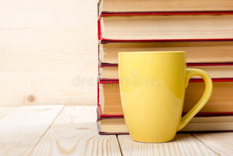 Stack of Colorful Books, Open Book and Cup on Wooden Table Stock Image ...