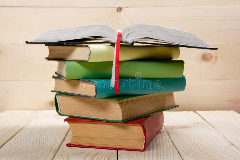Stack of Colorful Books, Open Book and Cup on Wooden Table. Back To ...