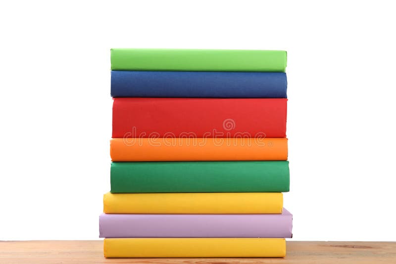 Stack of Colorful Books on Table Against White Background Stock Photo ...