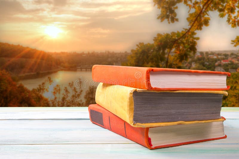 Stack of Colorful Books, Open Book and Cup on Wooden Table. Back To ...