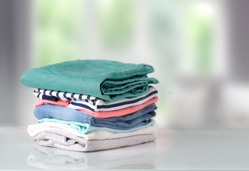 Stack Colorful Cotton Clothes on Table Empty Space Background. Stock ...